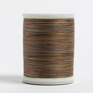 brown thread and needle
